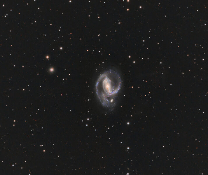 NGC 1097 - Barred spiral galaxy - Sky & Telescope - Sky & Telescope